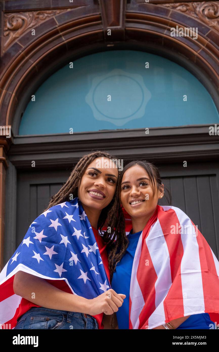 Women dressed in national?flags for world cup competition posing for ...