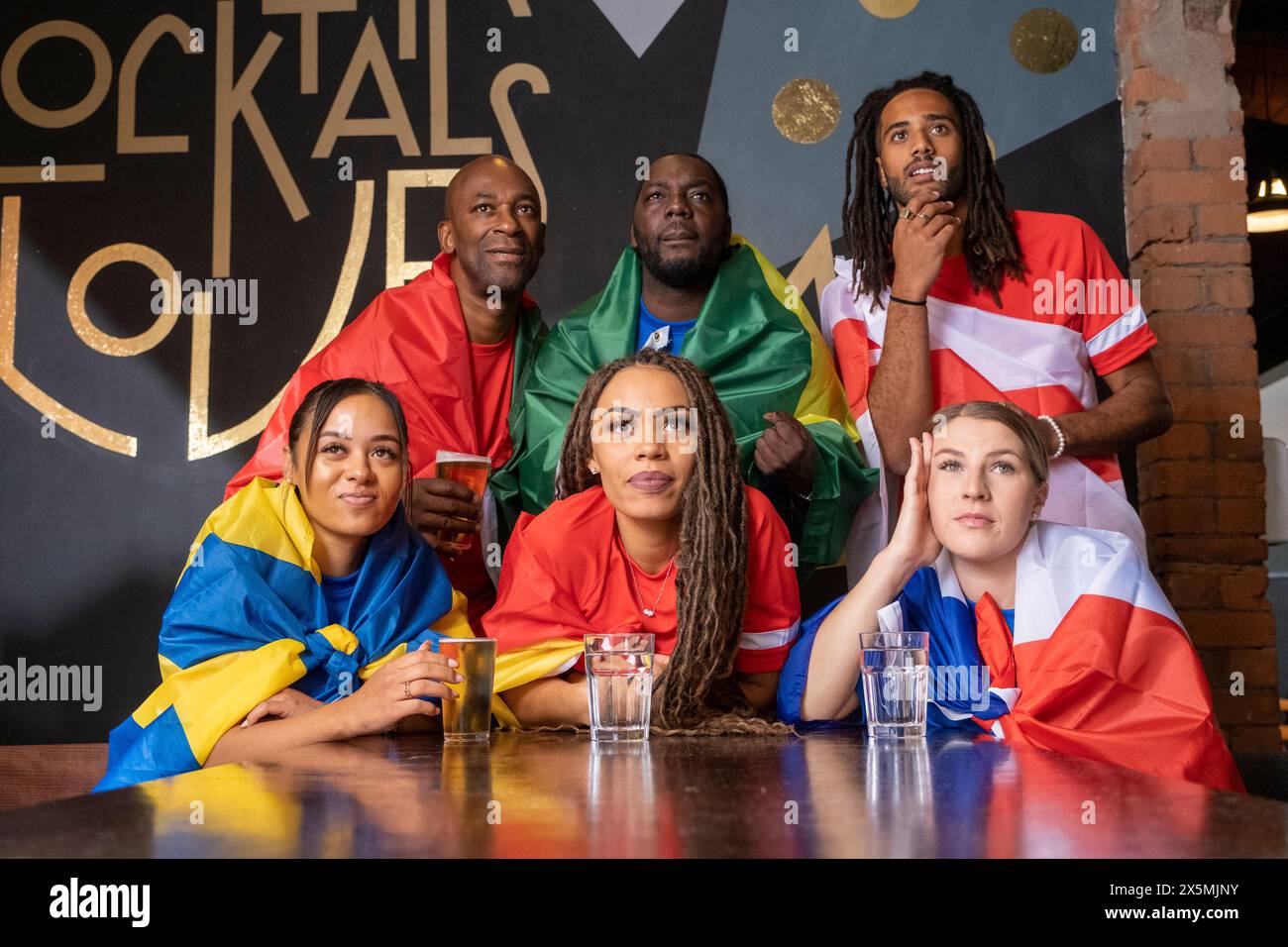 Friends dressed in national flags for world cup competition Stock Photo ...