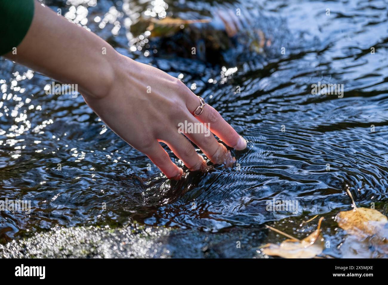 Hand touching surface water hi-res stock photography and images - Alamy