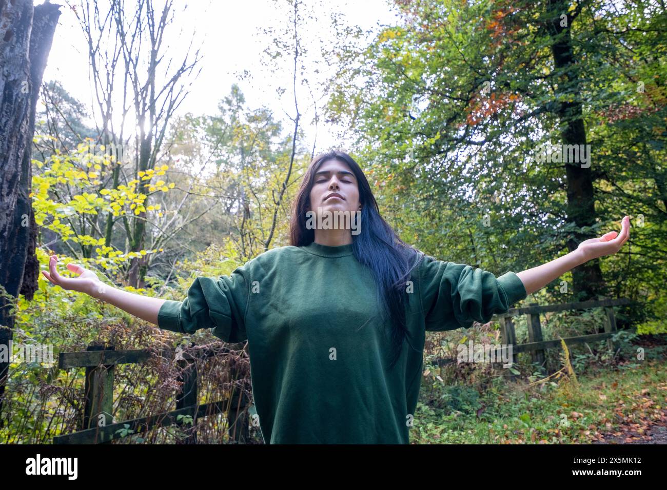 Woman in forest gesturing hi-res stock photography and images - Alamy