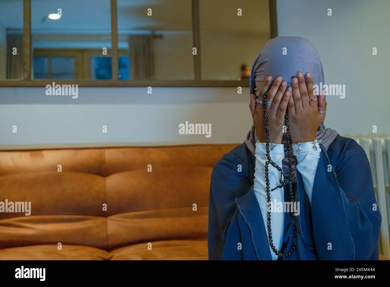 Muslim woman praying at home Stock Photo - Alamy