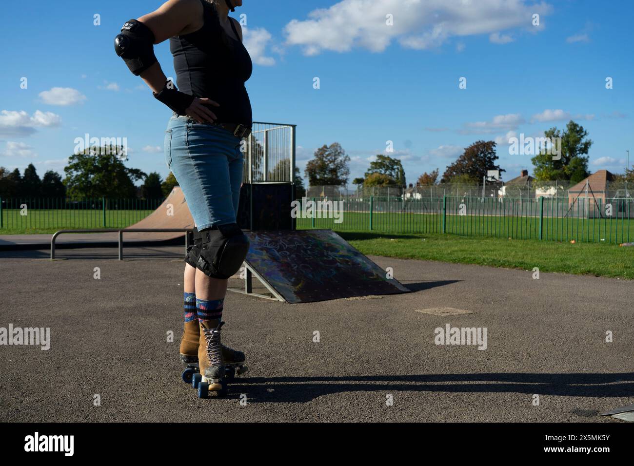 Low section of woman wearing roller skates Stock Photo - Alamy