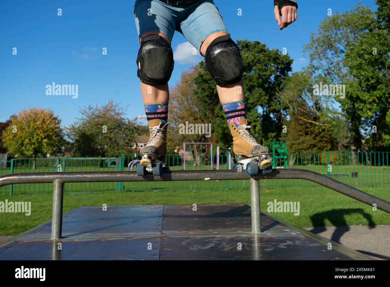 Low section of woman wearing roller skates Stock Photo - Alamy