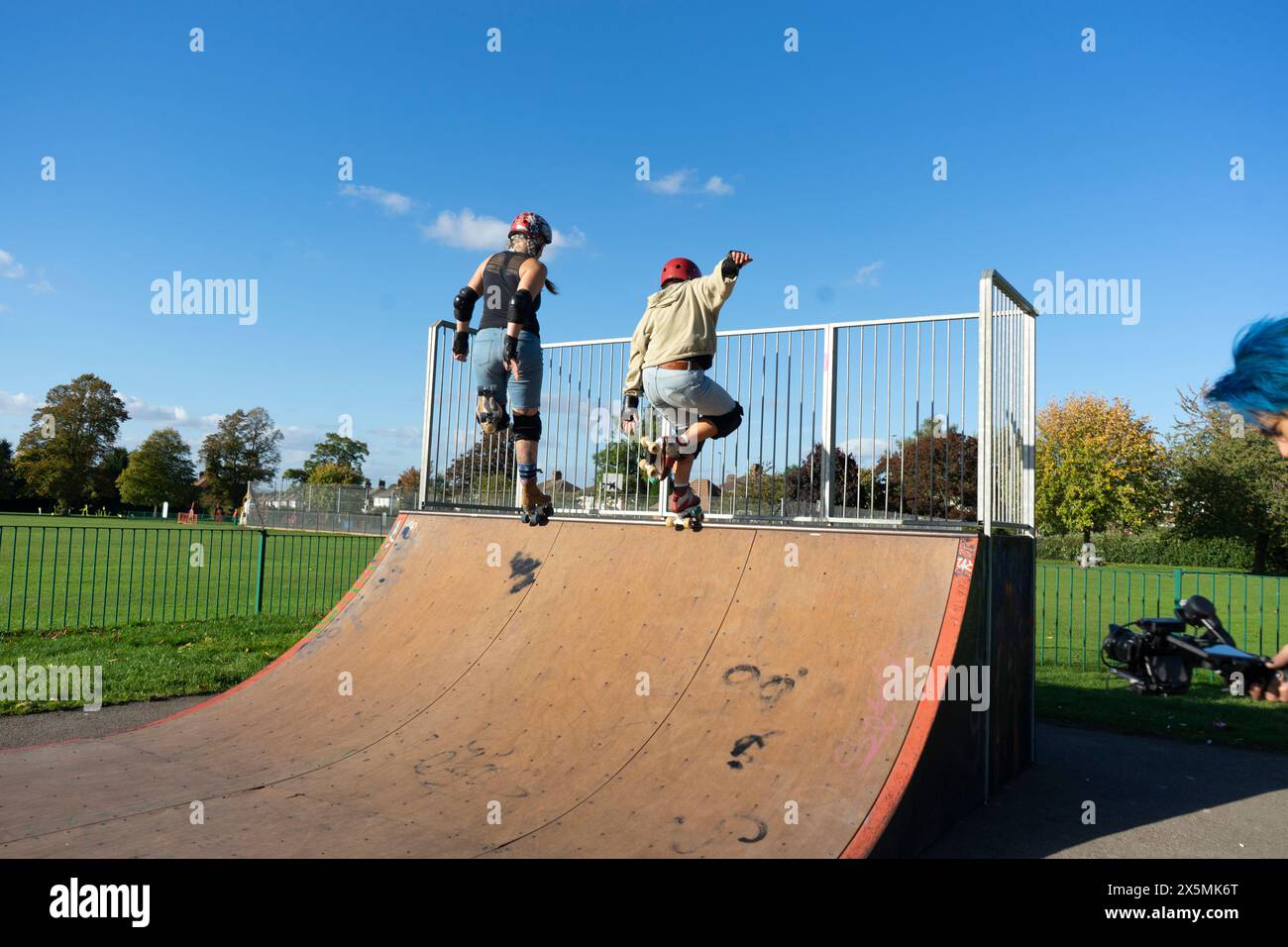 Two women roller-skating on ramp Stock Photo - Alamy