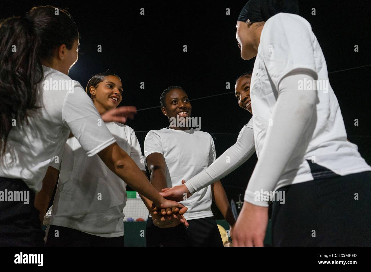 Female soccer players teaming up Stock Photo - Alamy