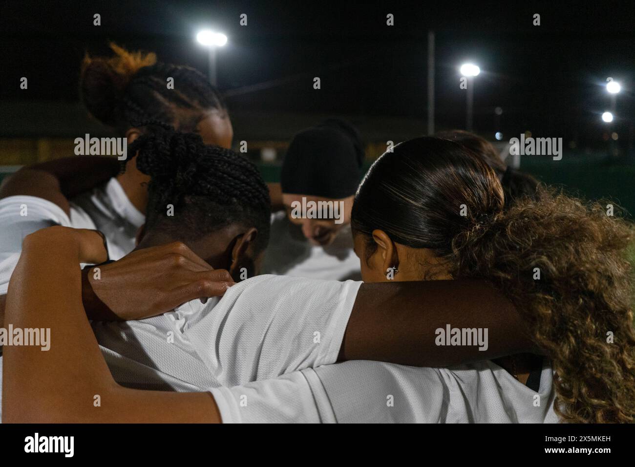 Female soccer players teaming up Stock Photo - Alamy