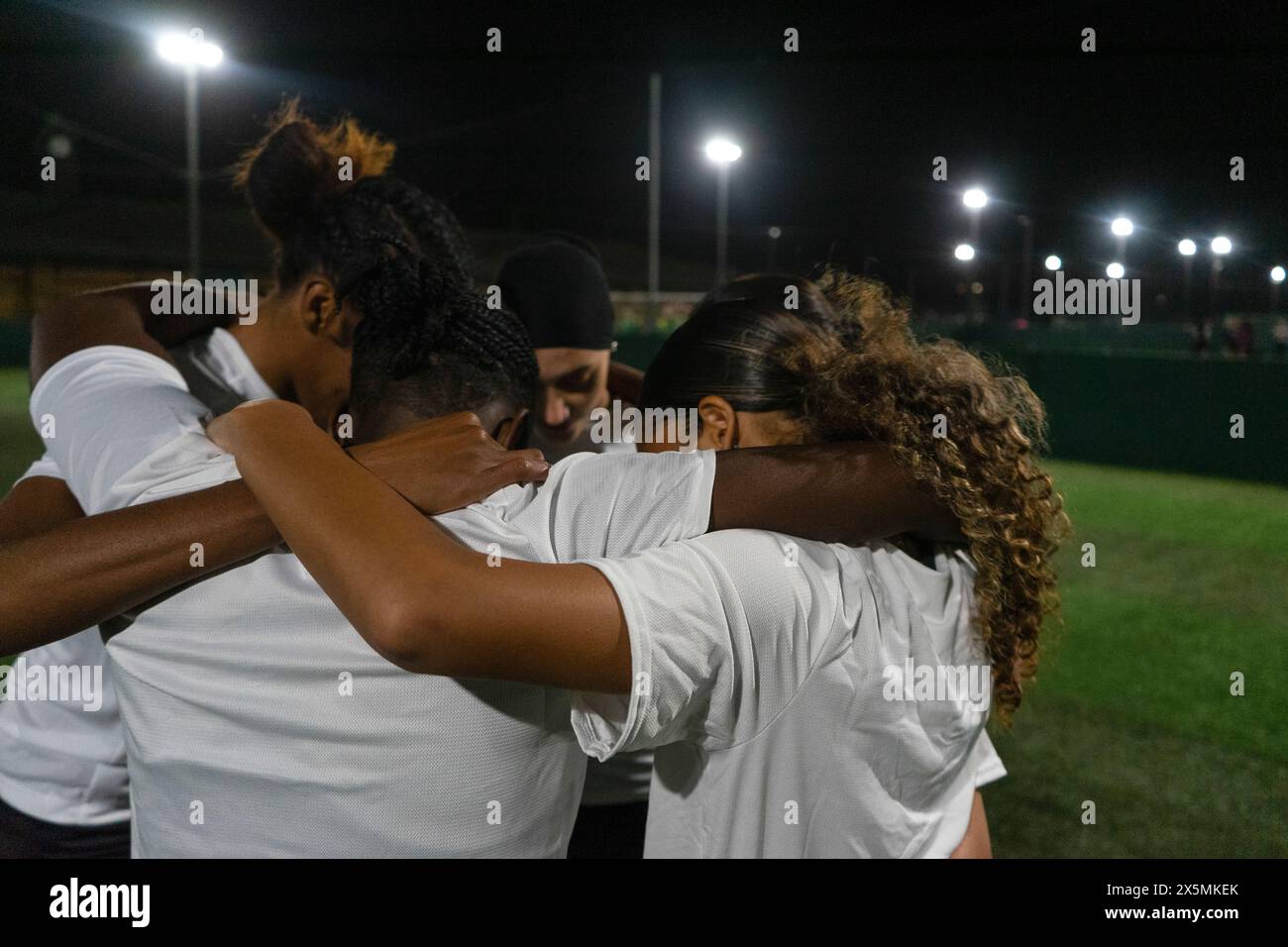 Female soccer players teaming up Stock Photo - Alamy