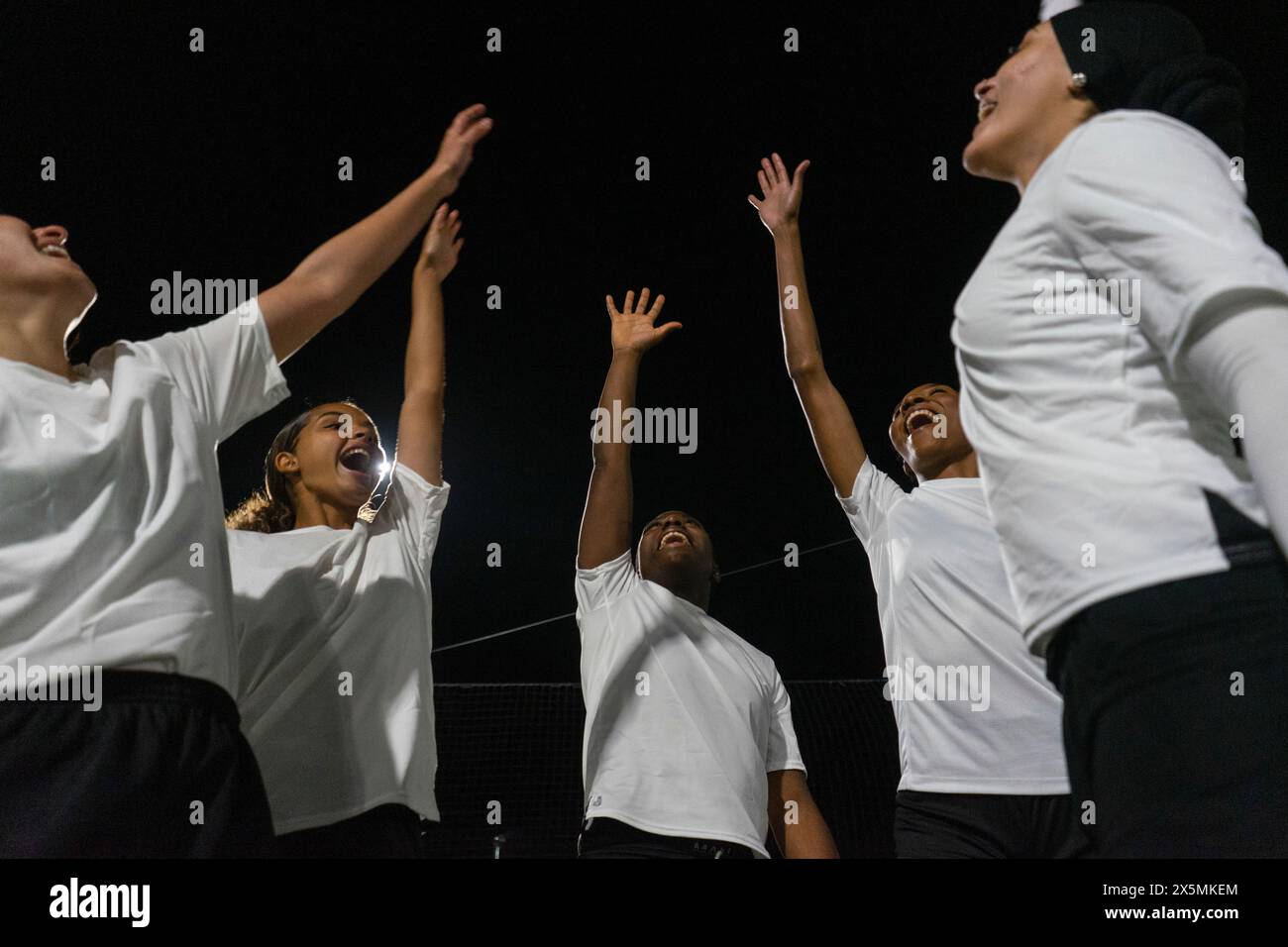 Female soccer players teaming up Stock Photo - Alamy