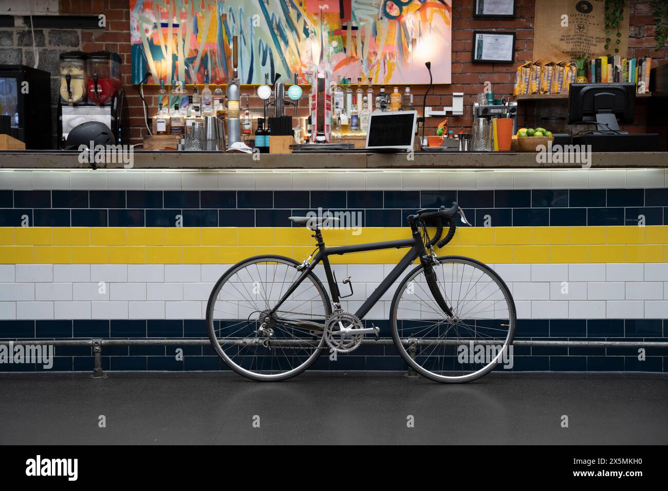 Bicycle at bar counter Stock Photo - Alamy
