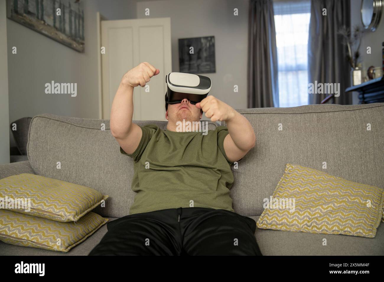 Vr man sofa hi-res stock photography and images - Alamy