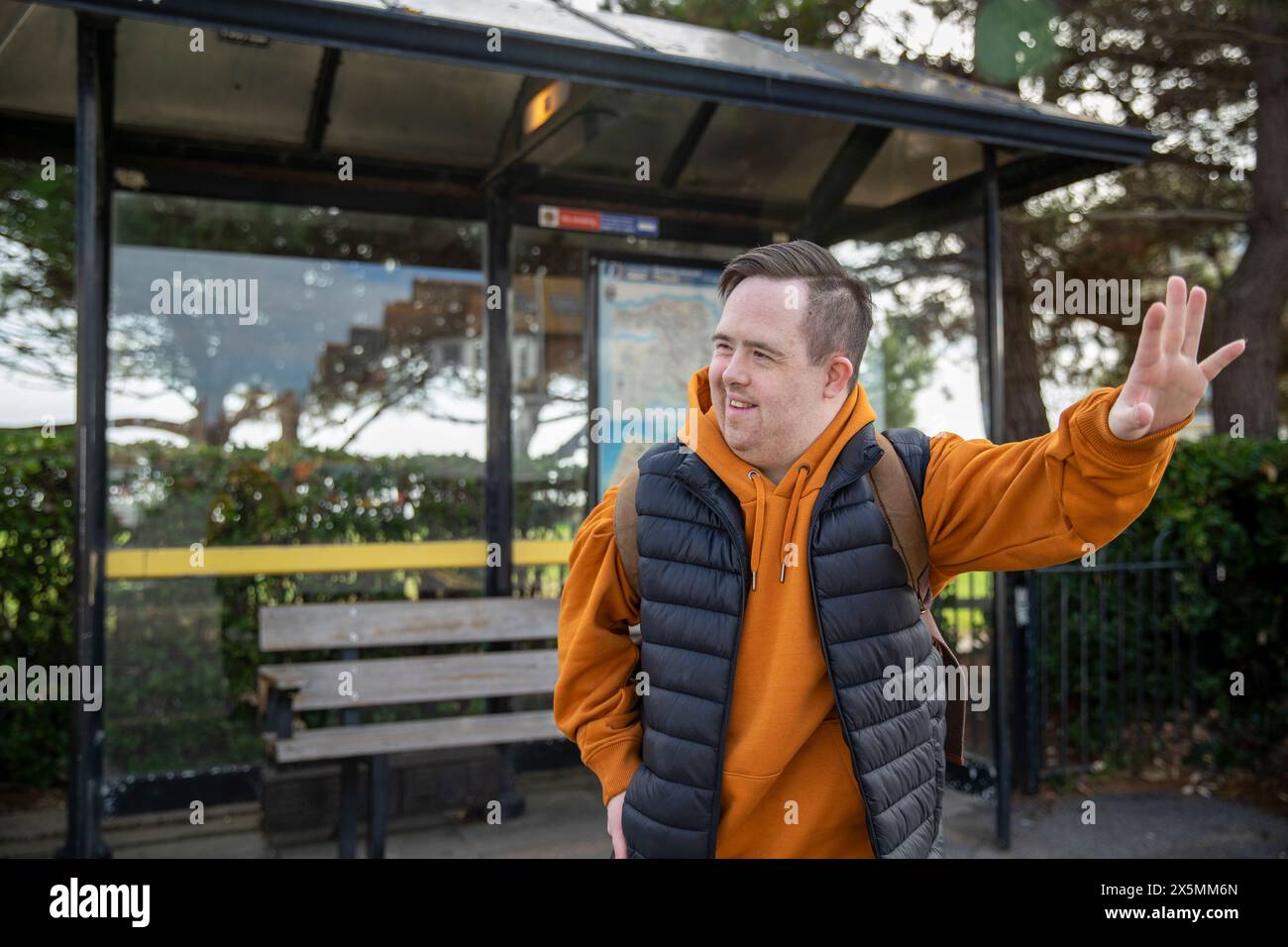 Man waiting at bus stop uk hi-res stock photography and images - Alamy