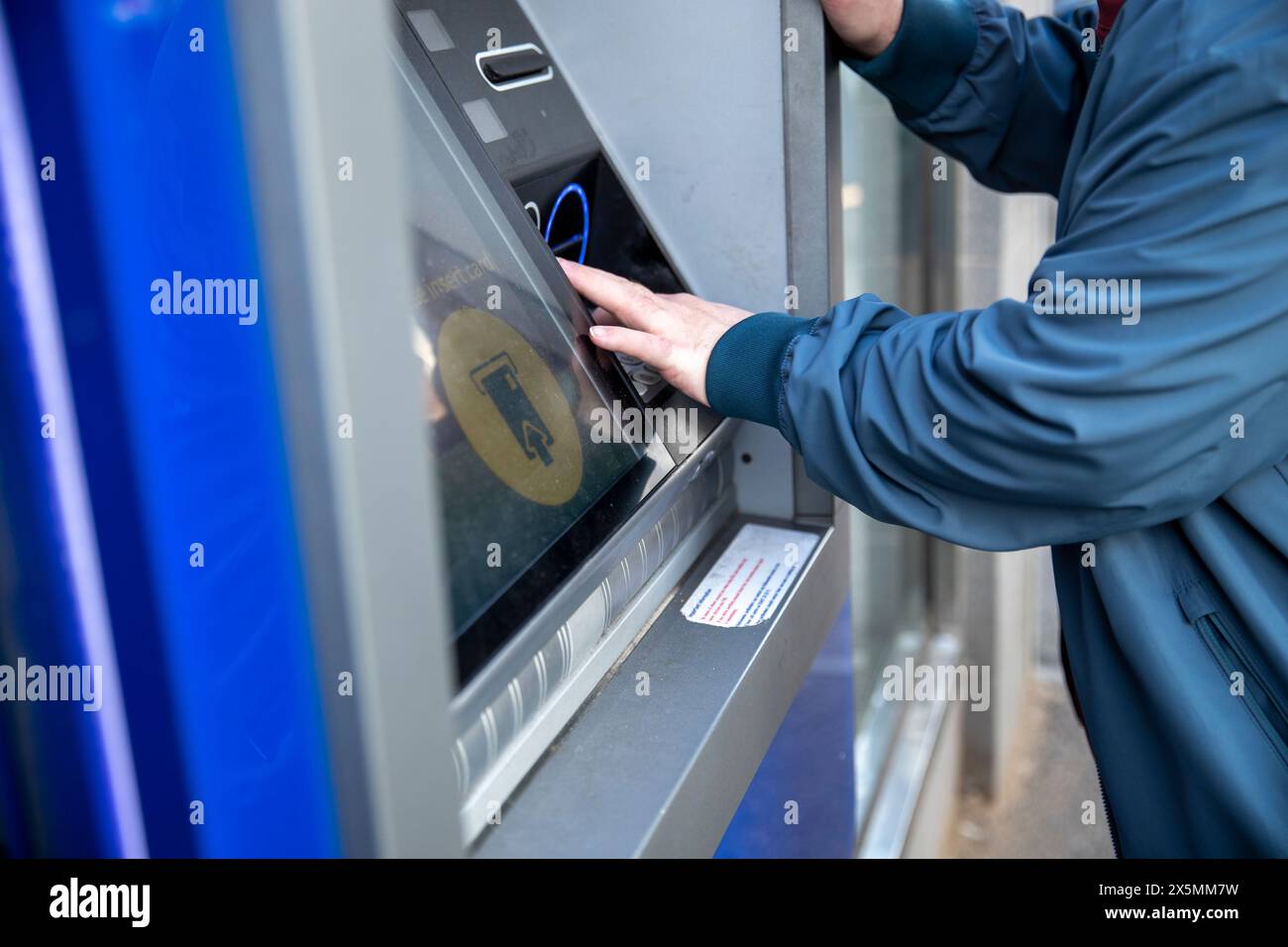 Man using cash machine keypad, close up Stock Photo - Alamy