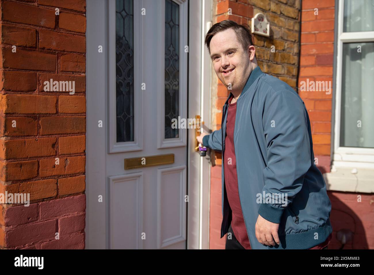 Man locking door of his house Stock Photo - Alamy