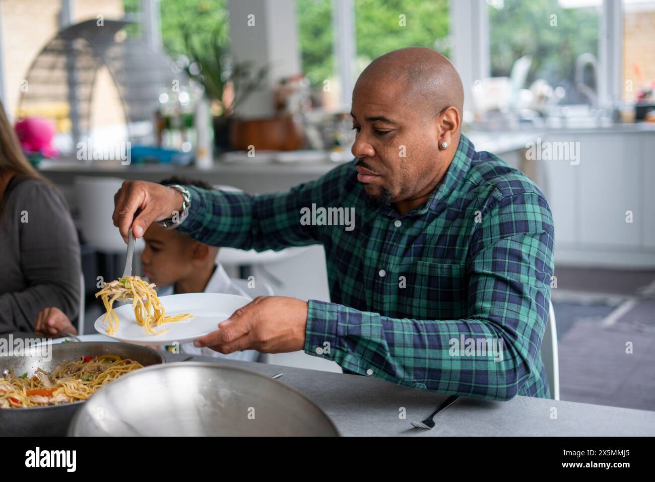 Man eating dinner home hi-res stock photography and images - Alamy