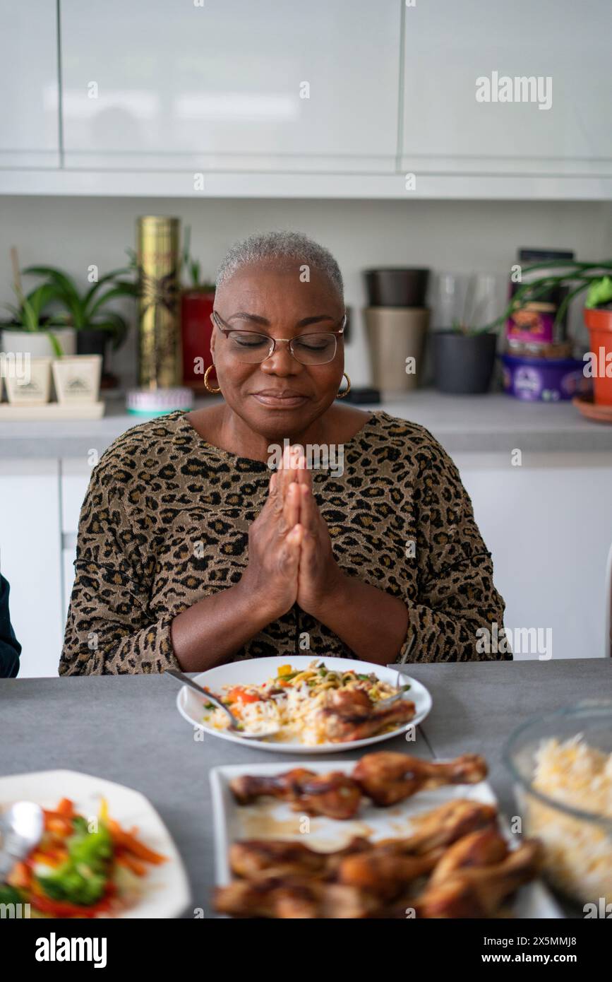 African woman praying hi-res stock photography and images - Alamy