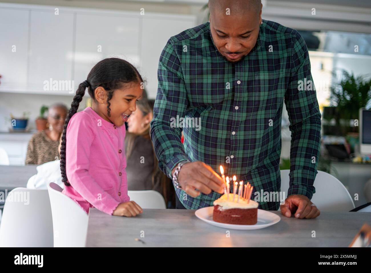 Father and daughter preparing birthday cake Stock Photo - Alamy