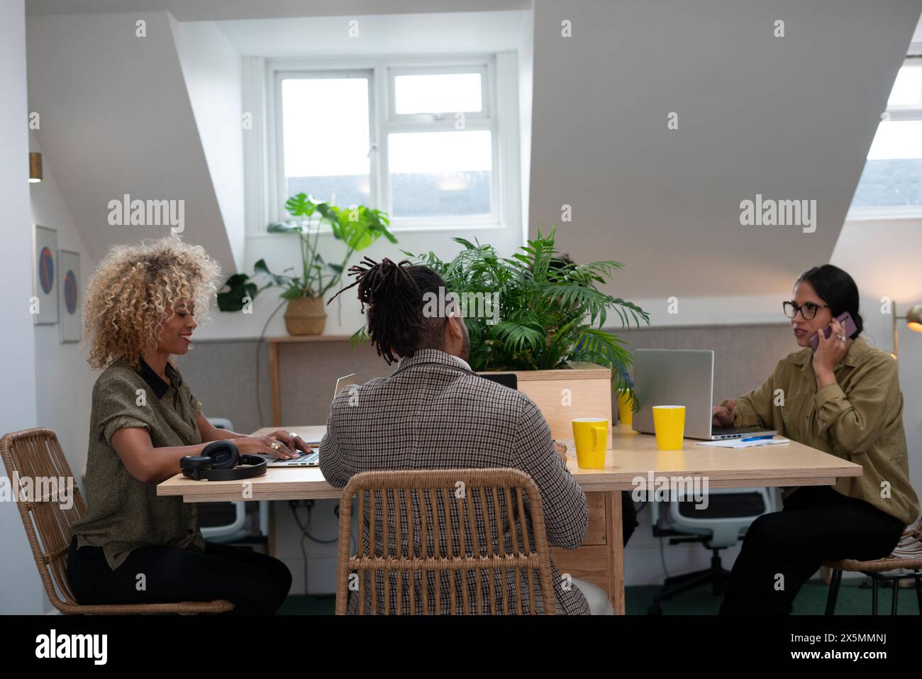Creative professionals working in office Stock Photo - Alamy