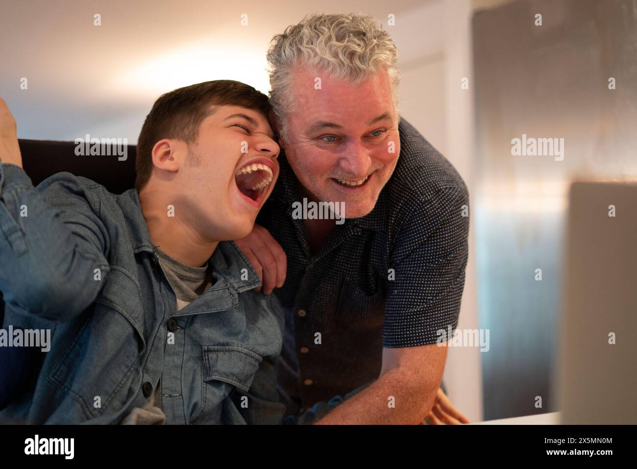 Father with laughing son Stock Photo - Alamy