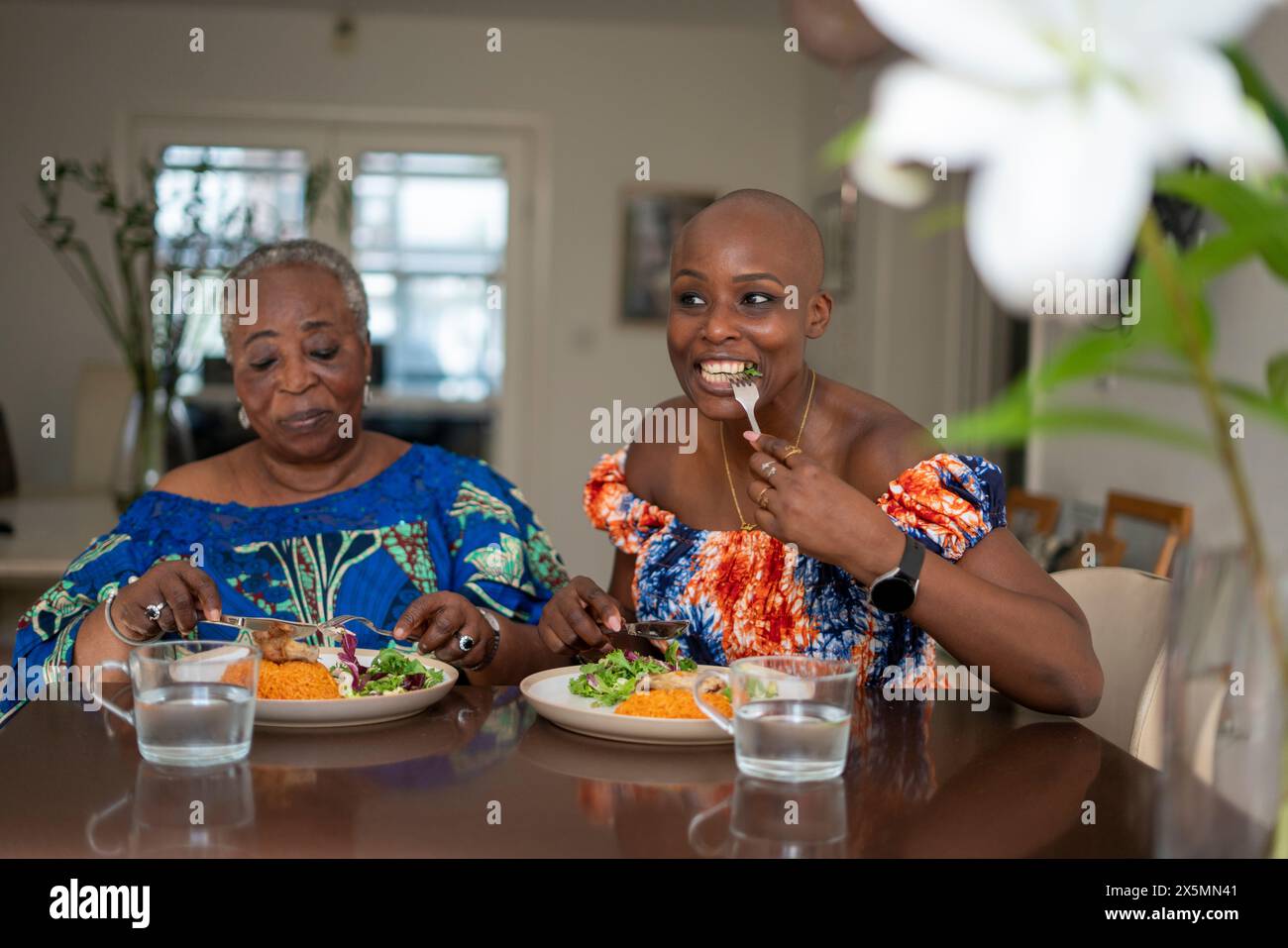 Senior woman daughter eating hi-res stock photography and images - Alamy