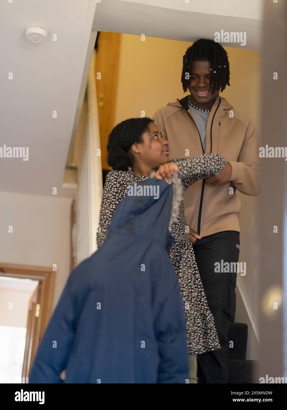 Child putting on life jacket hi-res stock photography and images - Alamy