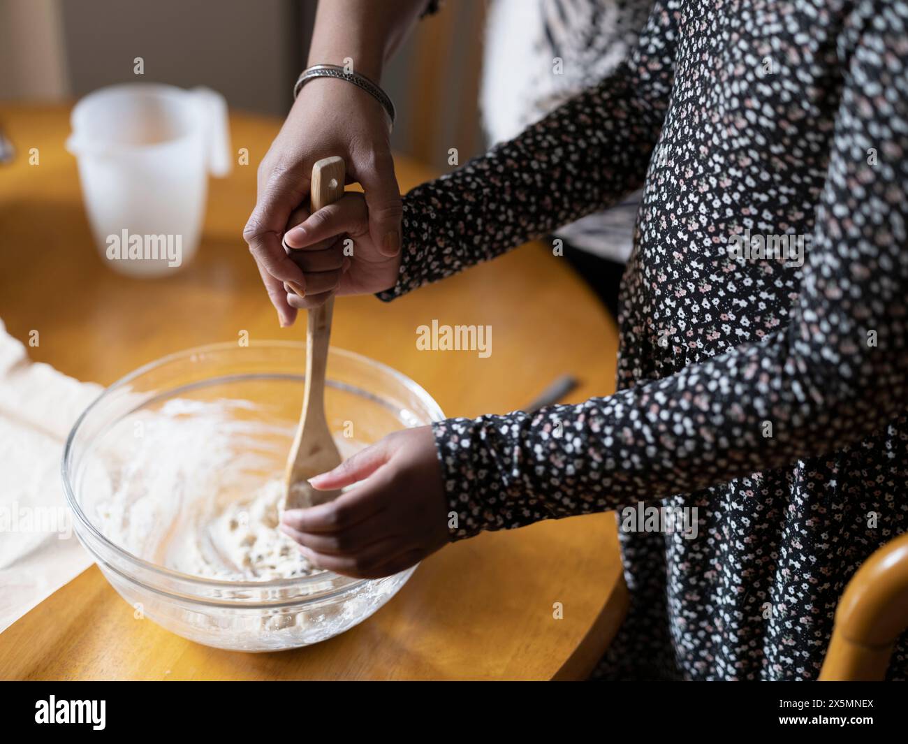 Mother and daughter mixing cookie batter at home Stock Photo - Alamy