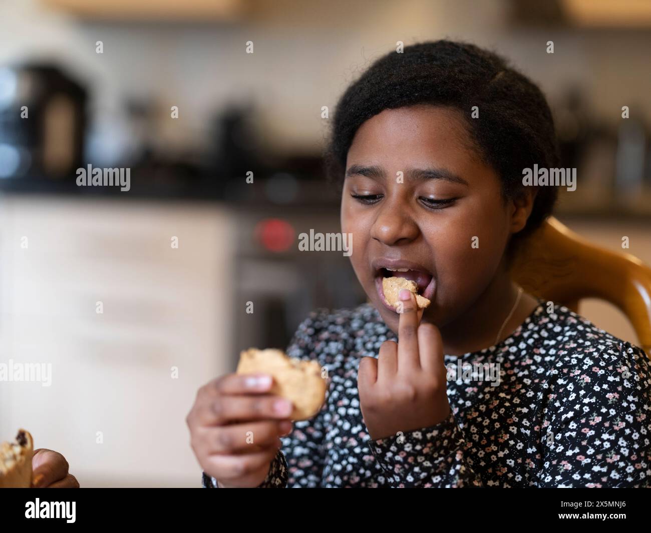 Black child eating cookie hi-res stock photography and images - Alamy