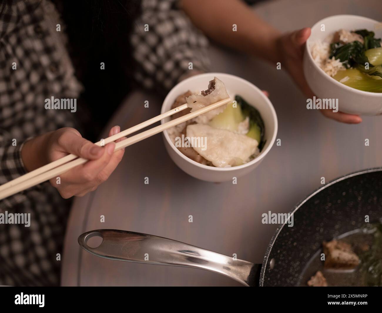 Man eating with chopsticks hi-res stock photography and images - Alamy