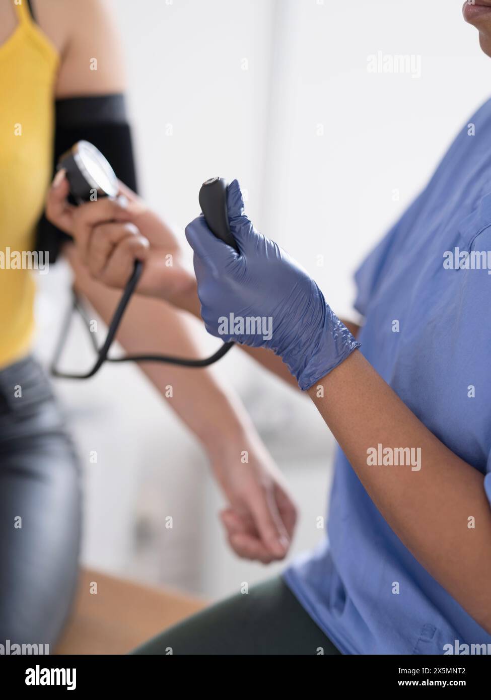 Close-up of doctors hands checking patients blood pressure Stock Photo ...