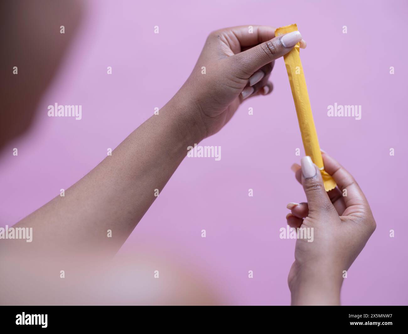 Close-up of womans hands holding tampon Stock Photo - Alamy