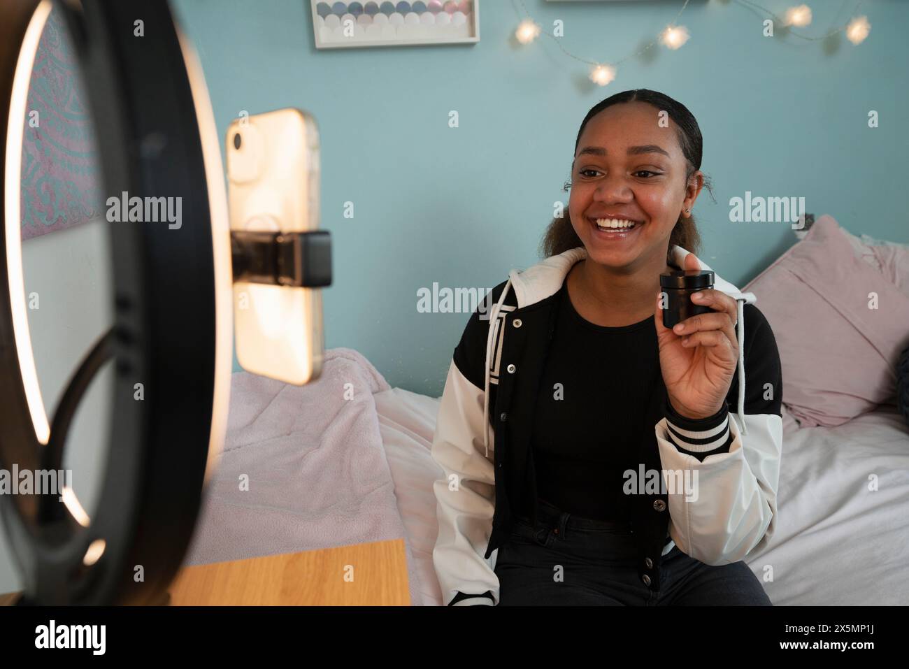Girl filming beauty video at home Stock Photo - Alamy