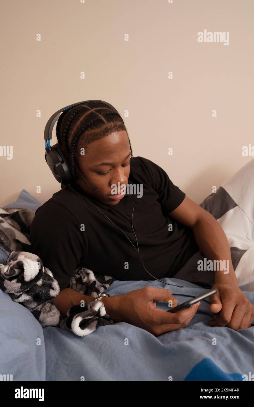 Teenage boy listening to music hi-res stock photography and images - Alamy