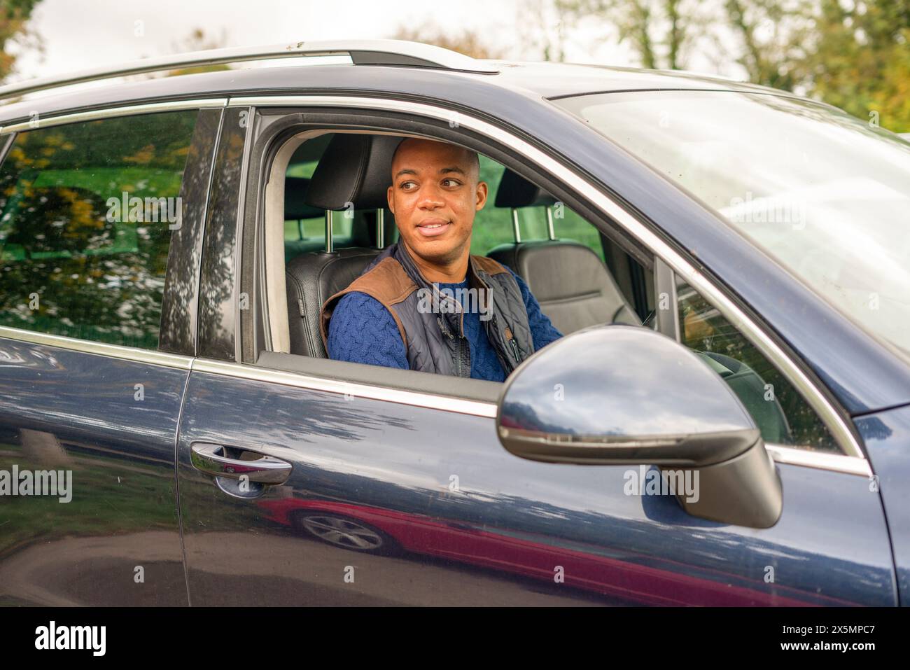 Man sitting in car Stock Photo - Alamy