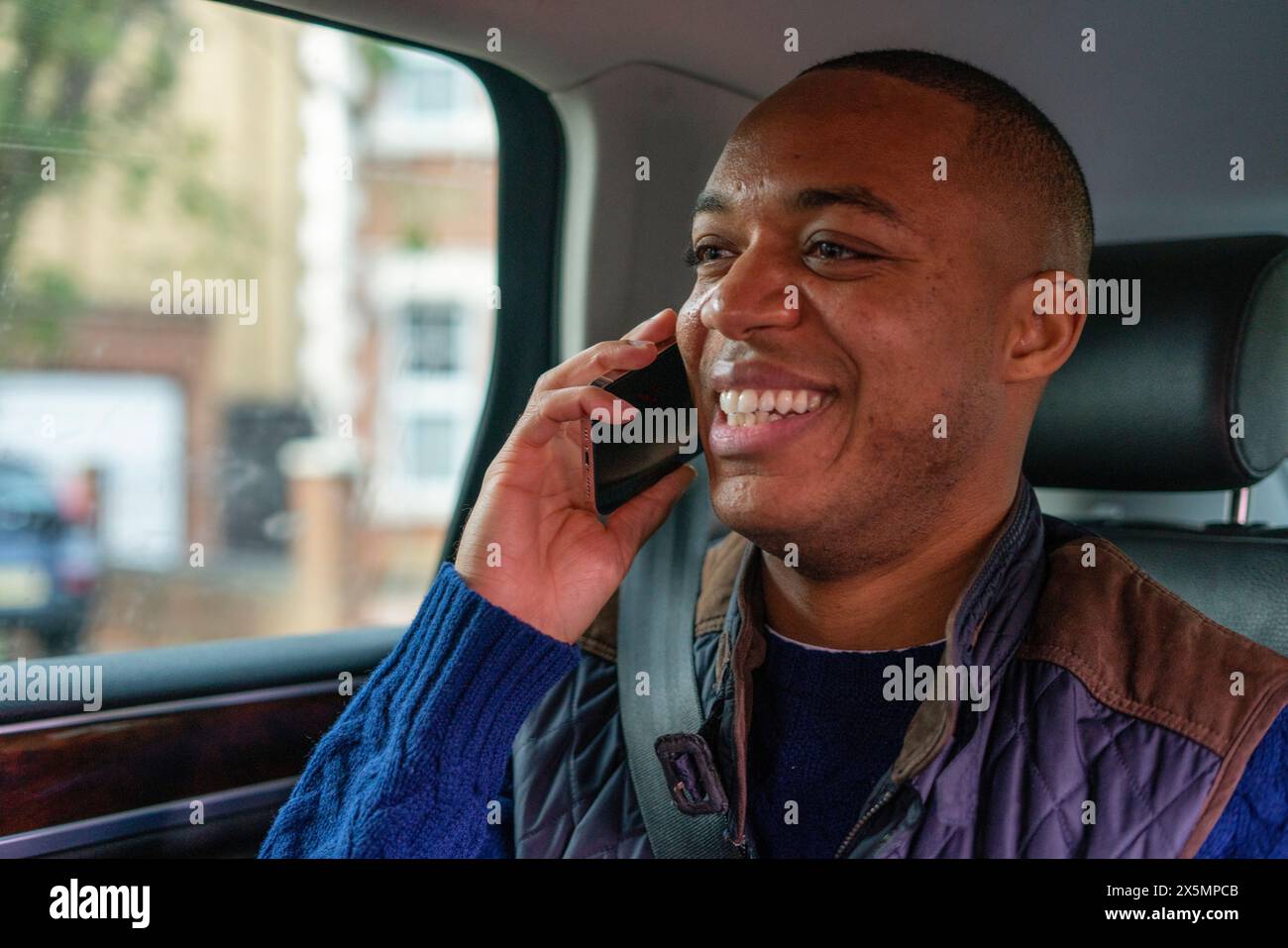 Black man using car hi-res stock photography and images - Alamy