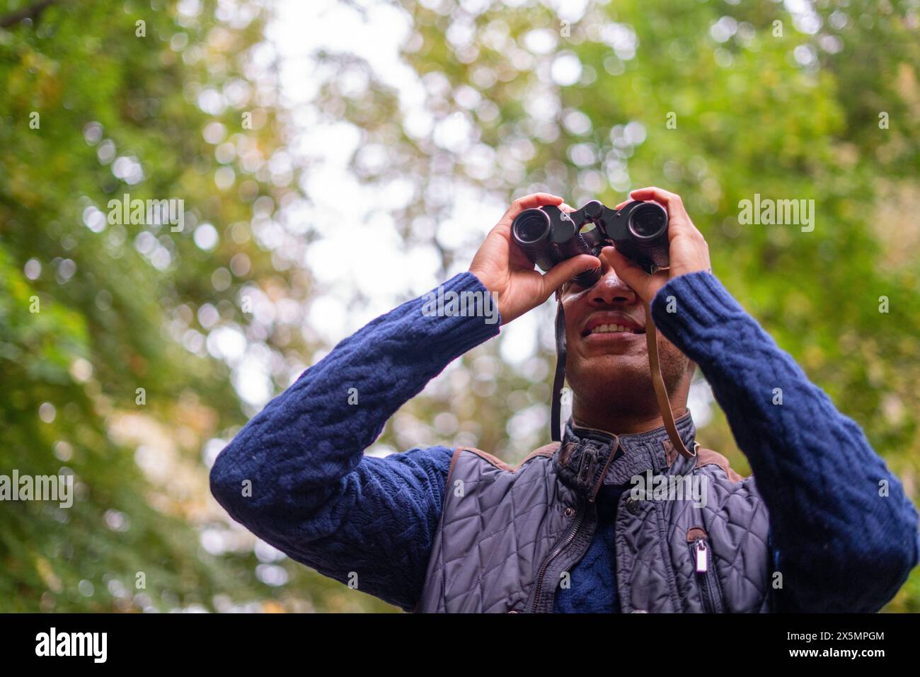 Man smiling with bird hi-res stock photography and images - Alamy