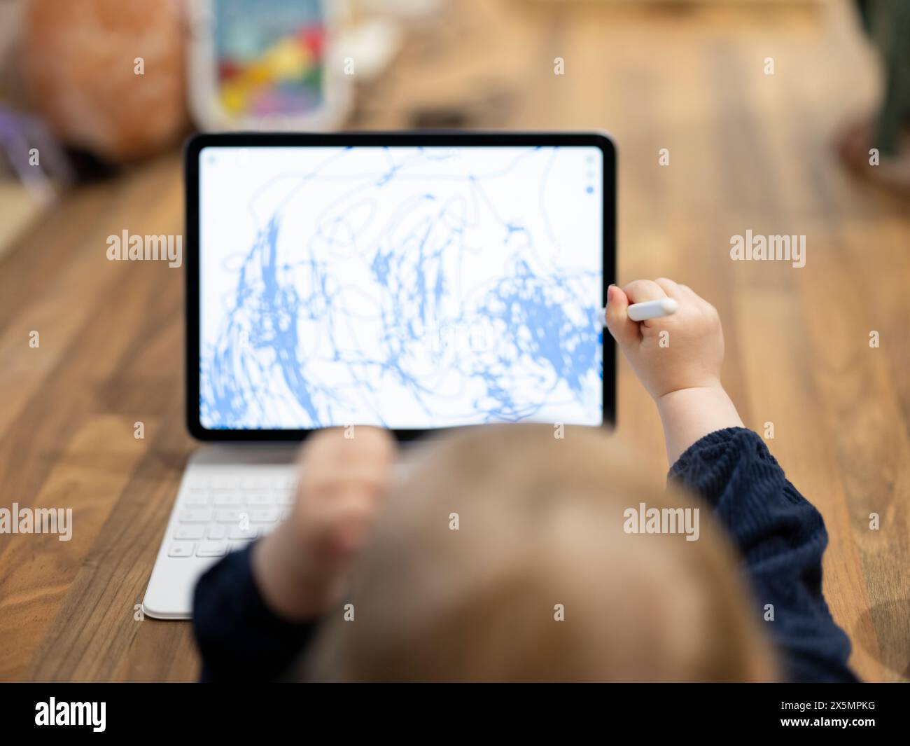 High angle of girl drawing on digital tablet Stock Photo - Alamy