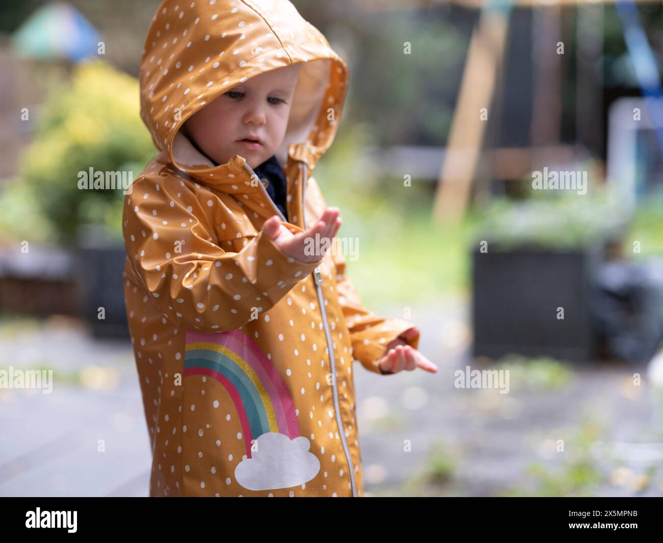 Girl wearing raincoat hi-res stock photography and images - Alamy