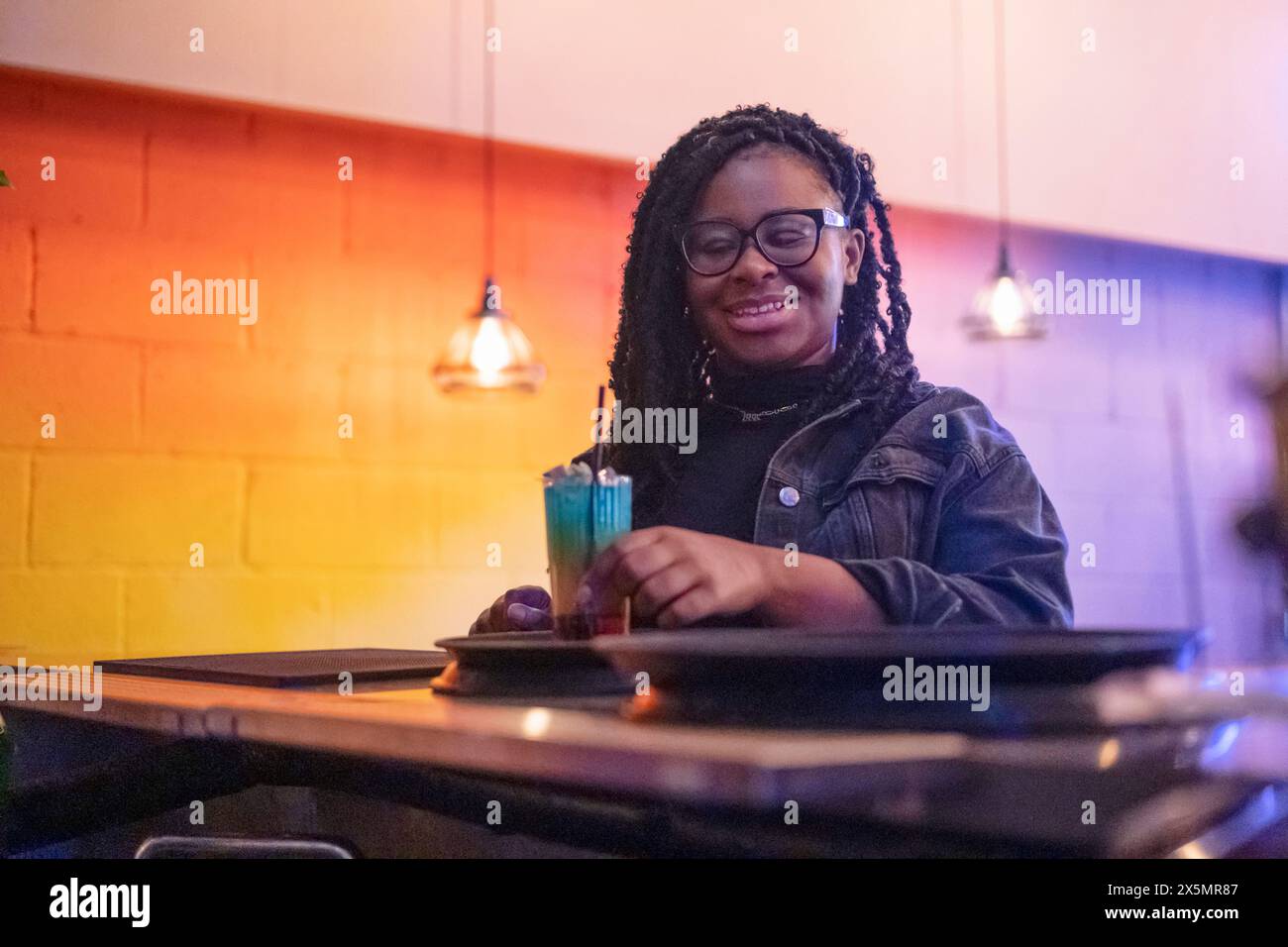 Woman bar standing counter hi-res stock photography and images - Alamy