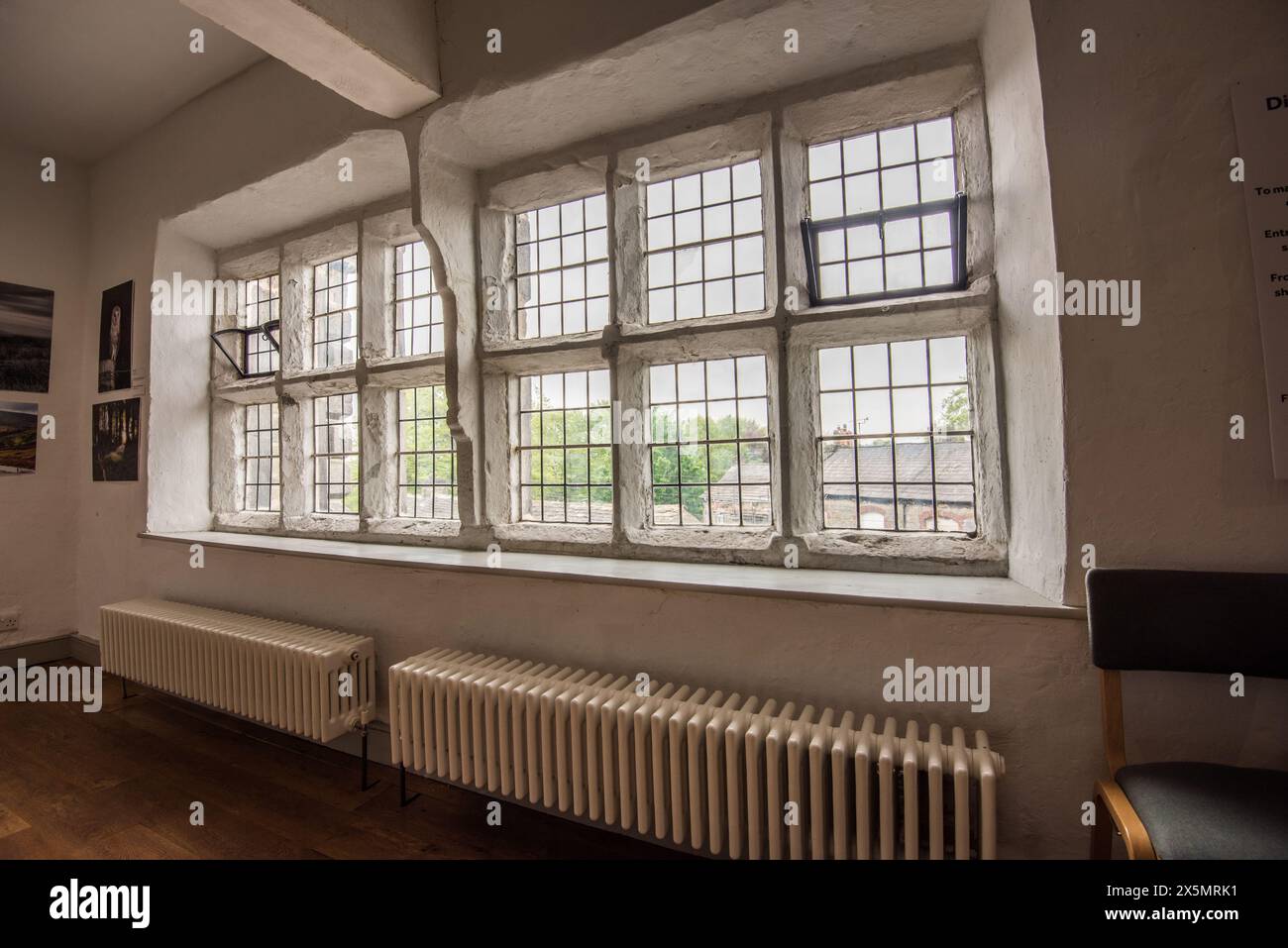 Upper floor windows in historic building in Settle known as 'The Folly ...