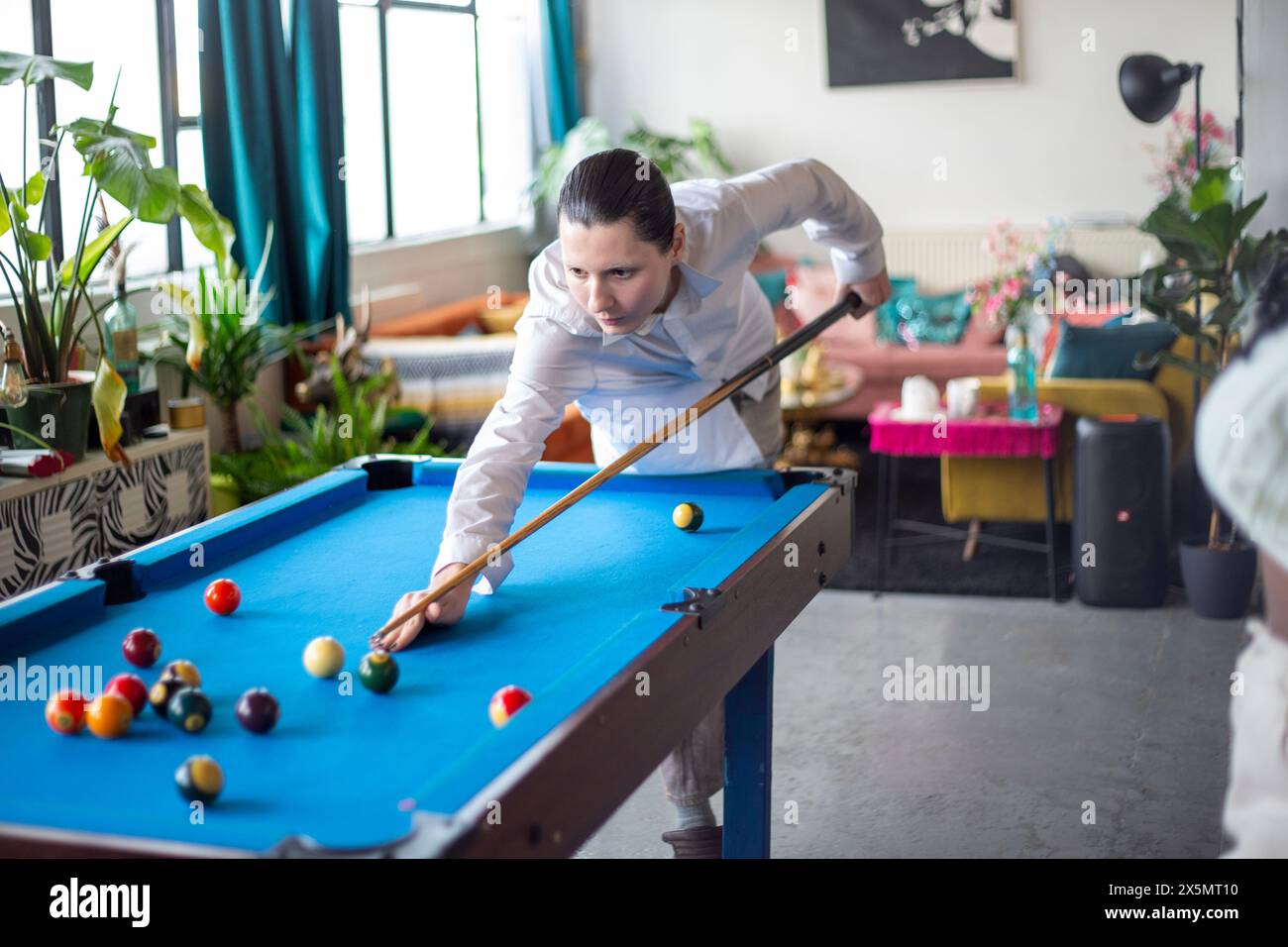 Person playing pool at home Stock Photo - Alamy