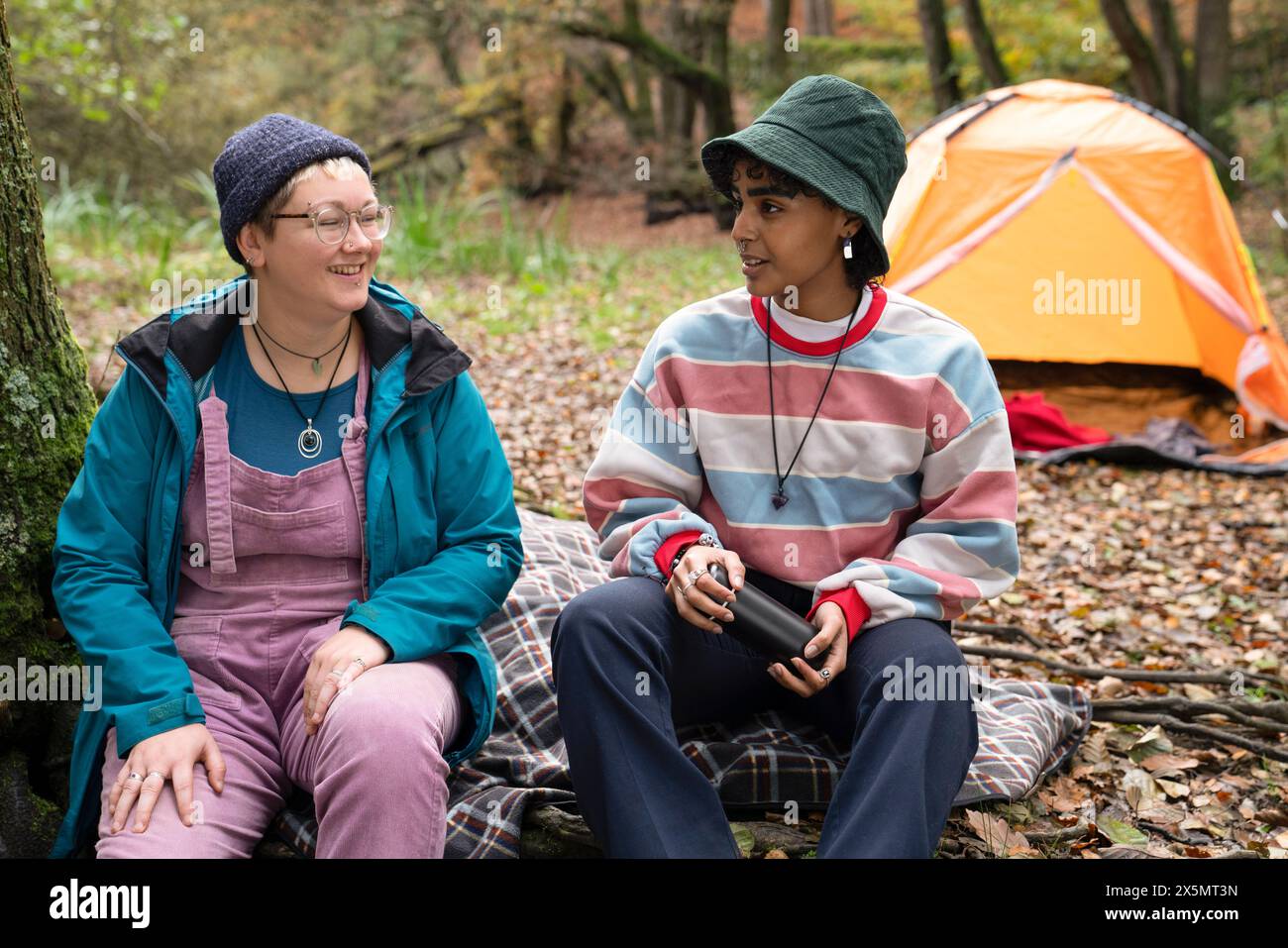 Smiling female friends camping hi-res stock photography and images - Alamy