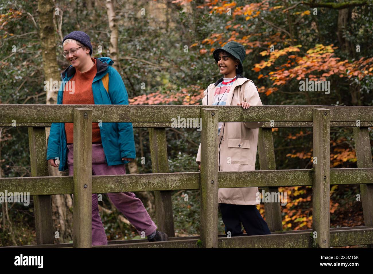 Three multiracial friends walking hi-res stock photography and images ...