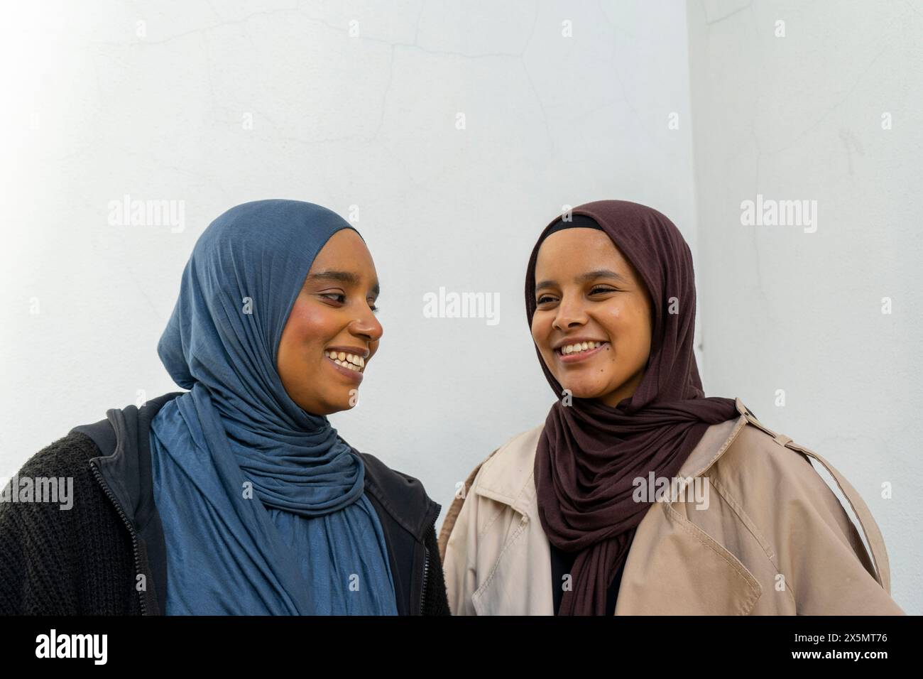 Portrait of two young women wearing hijabs Stock Photo - Alamy