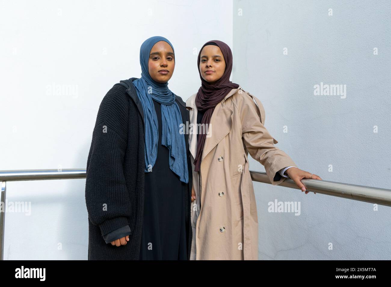 Portrait of two young women wearing hijabs Stock Photo - Alamy