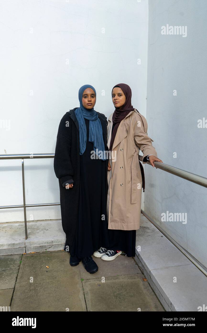 Portrait of two young women wearing hijabs Stock Photo - Alamy