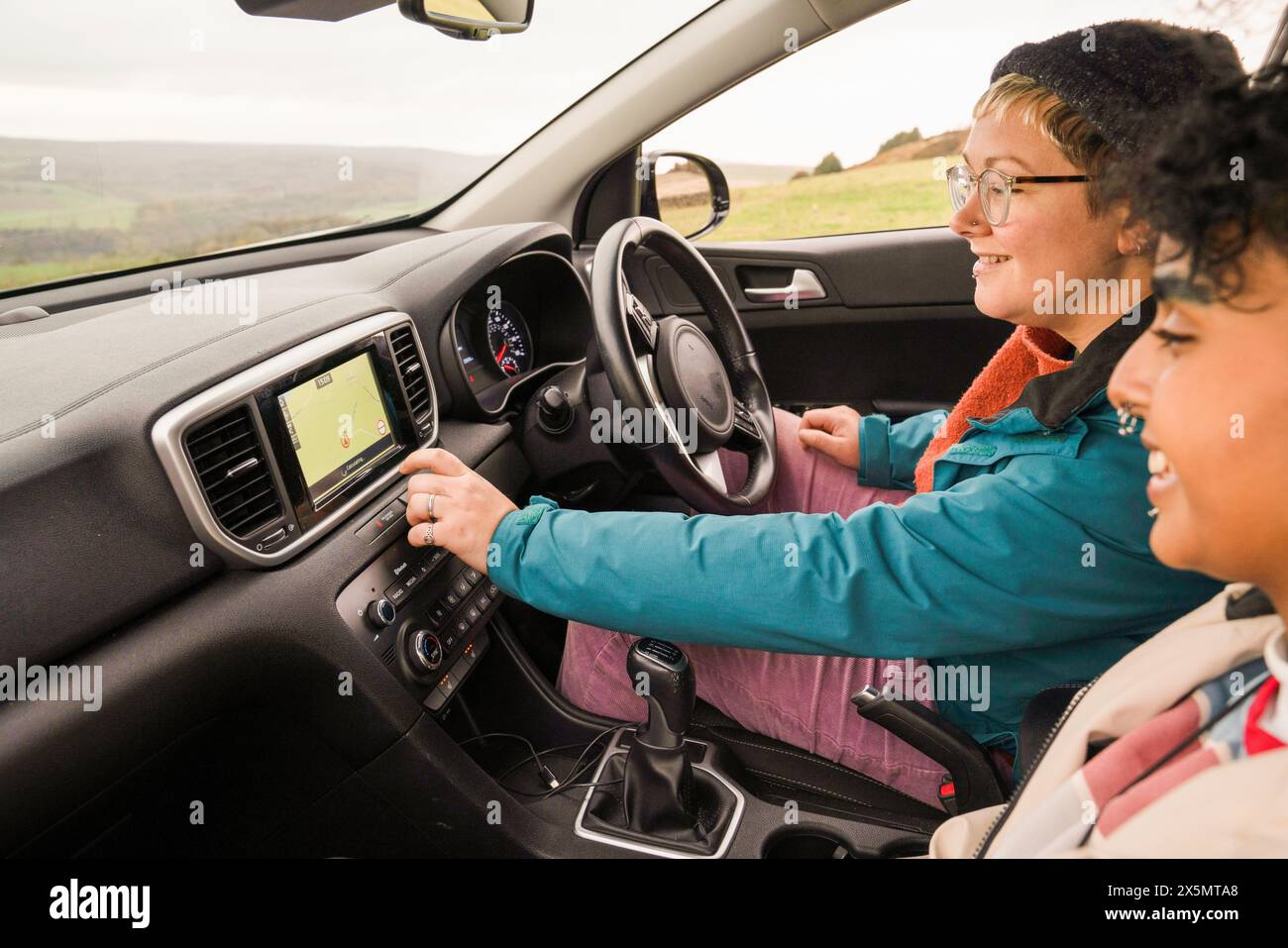 Female friends using GPS in car Stock Photo - Alamy