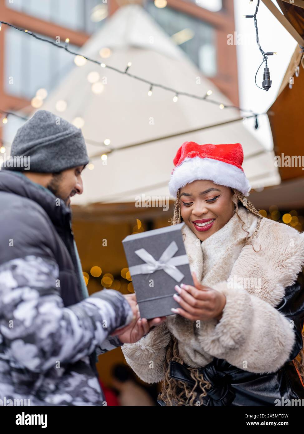 Present giving and man hi-res stock photography and images - Alamy