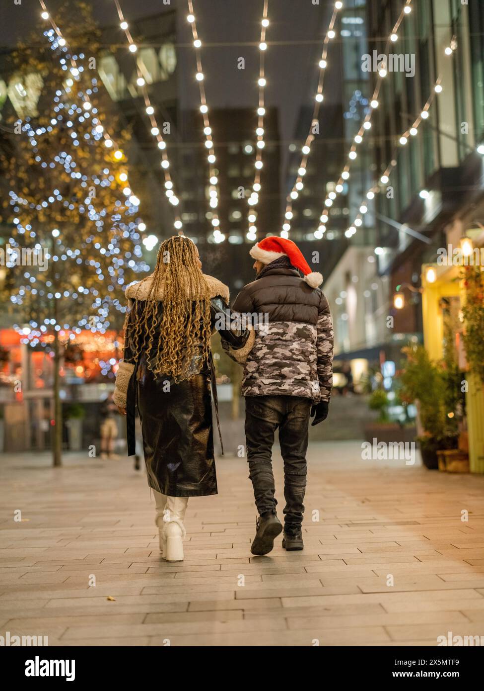 Women braided hair walking rear view hi-res stock photography and ...