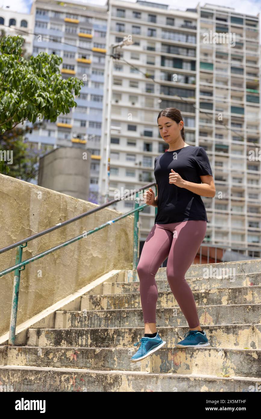 Woman training on steps in hi-res stock photography and images - Alamy