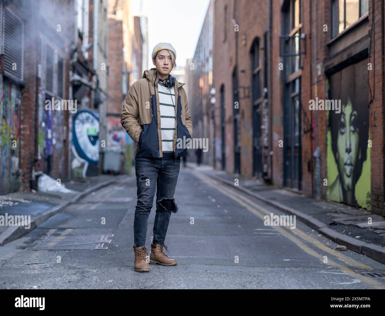 Portrait of man standing in city street Stock Photo - Alamy