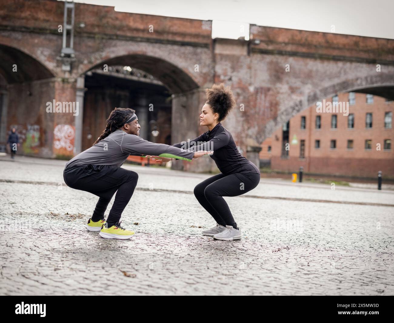 African american woman squats hi-res stock photography and images - Alamy
